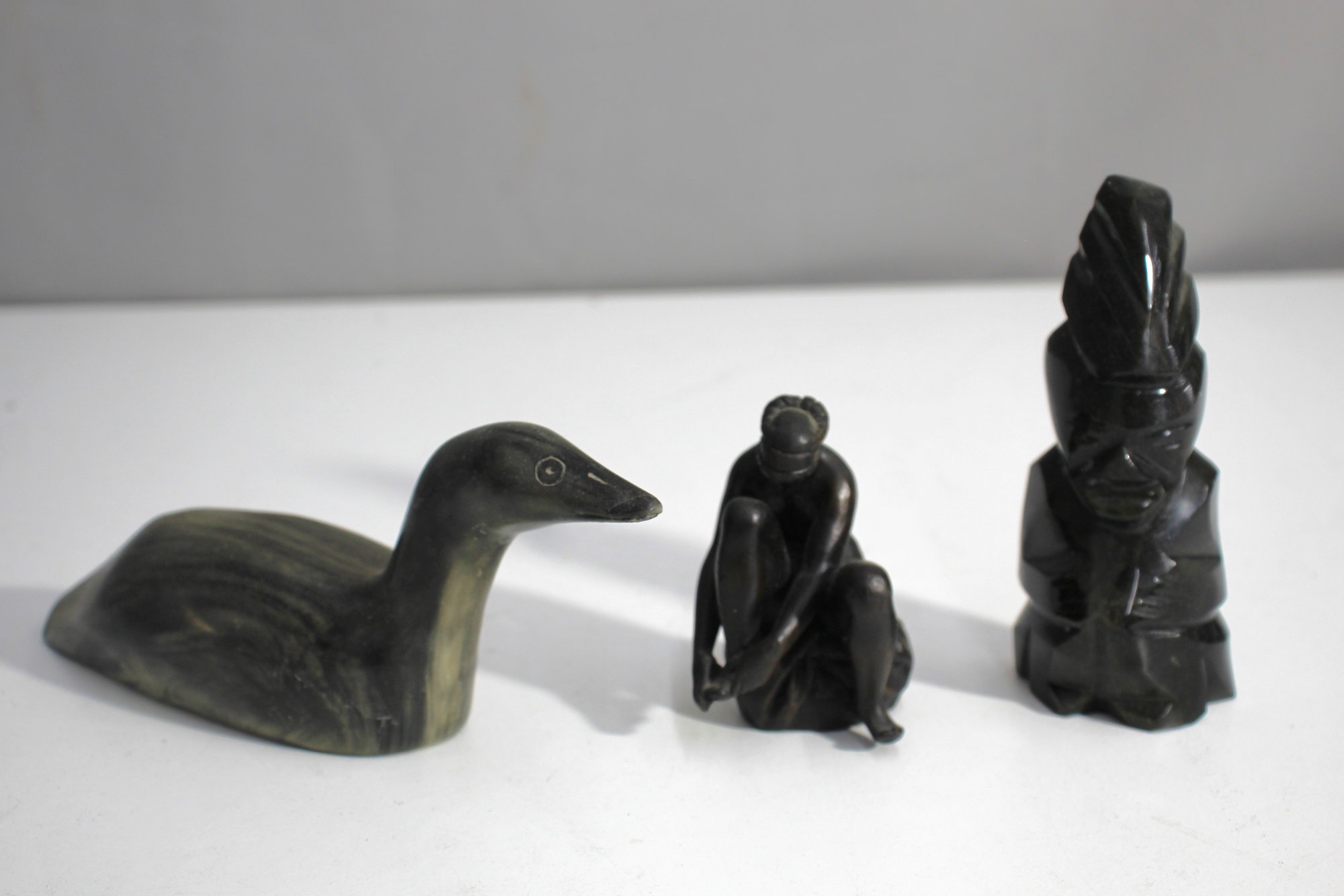 Set Of Three Sculptures: Aztec-Inspired Stone Statue, Wooden Duck, And ...