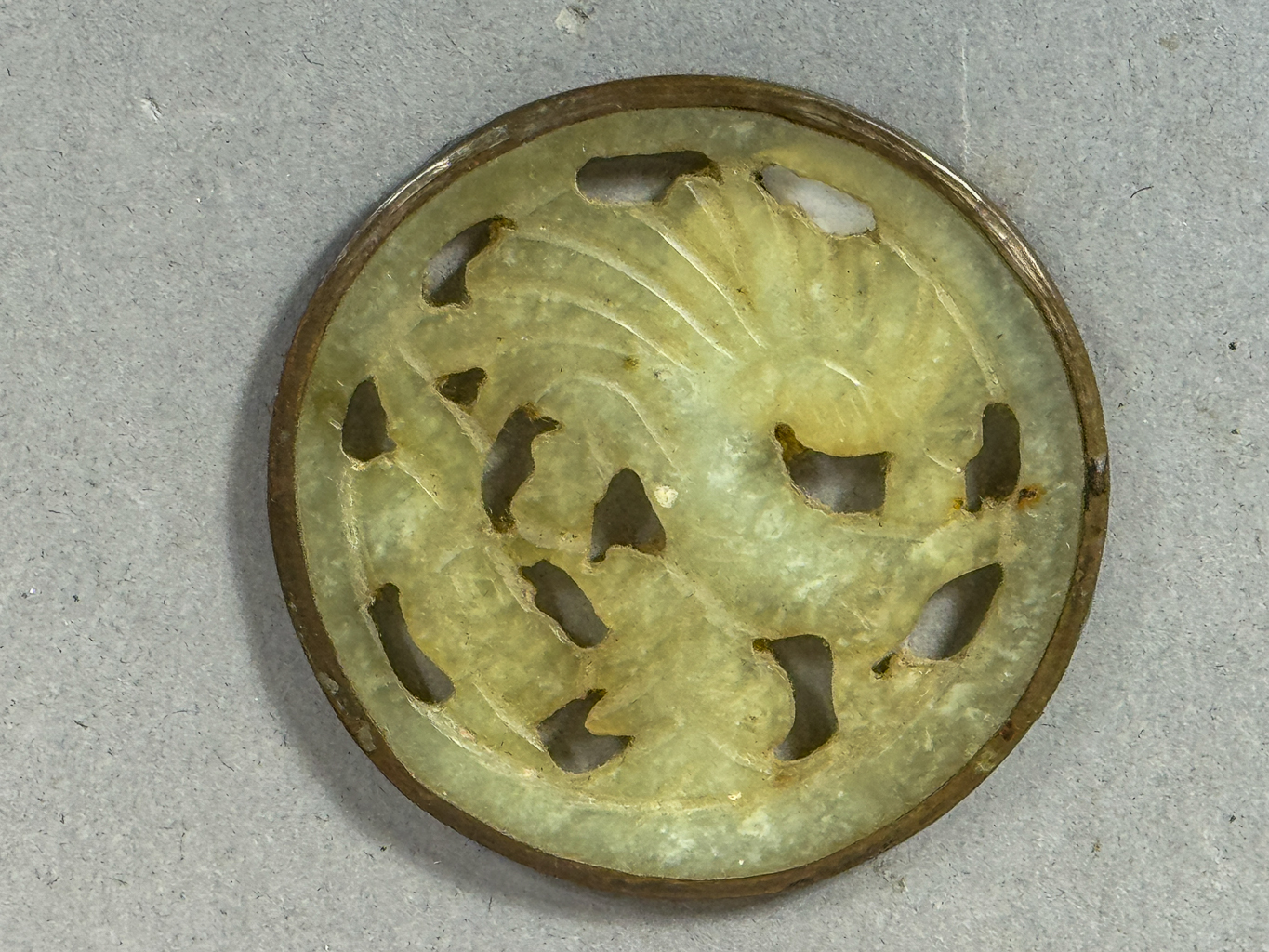 AN EARLY CARVED JADE BEE, 2.25" DIAMETER #1932882 | Auctionninja.com