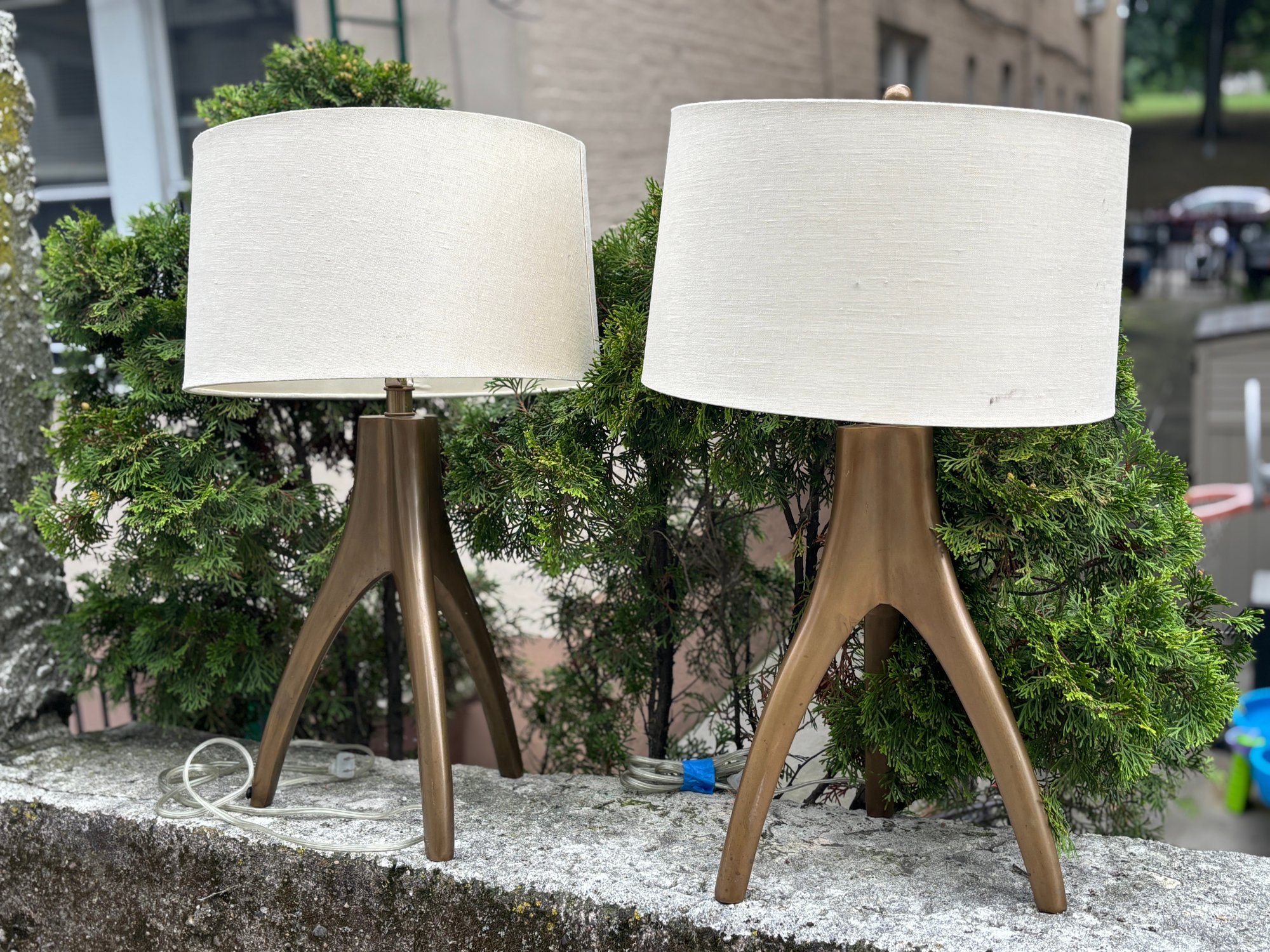 Pair Of Striking CB2 Tripod Brass Table Lamps With Linen Drum Shades ...