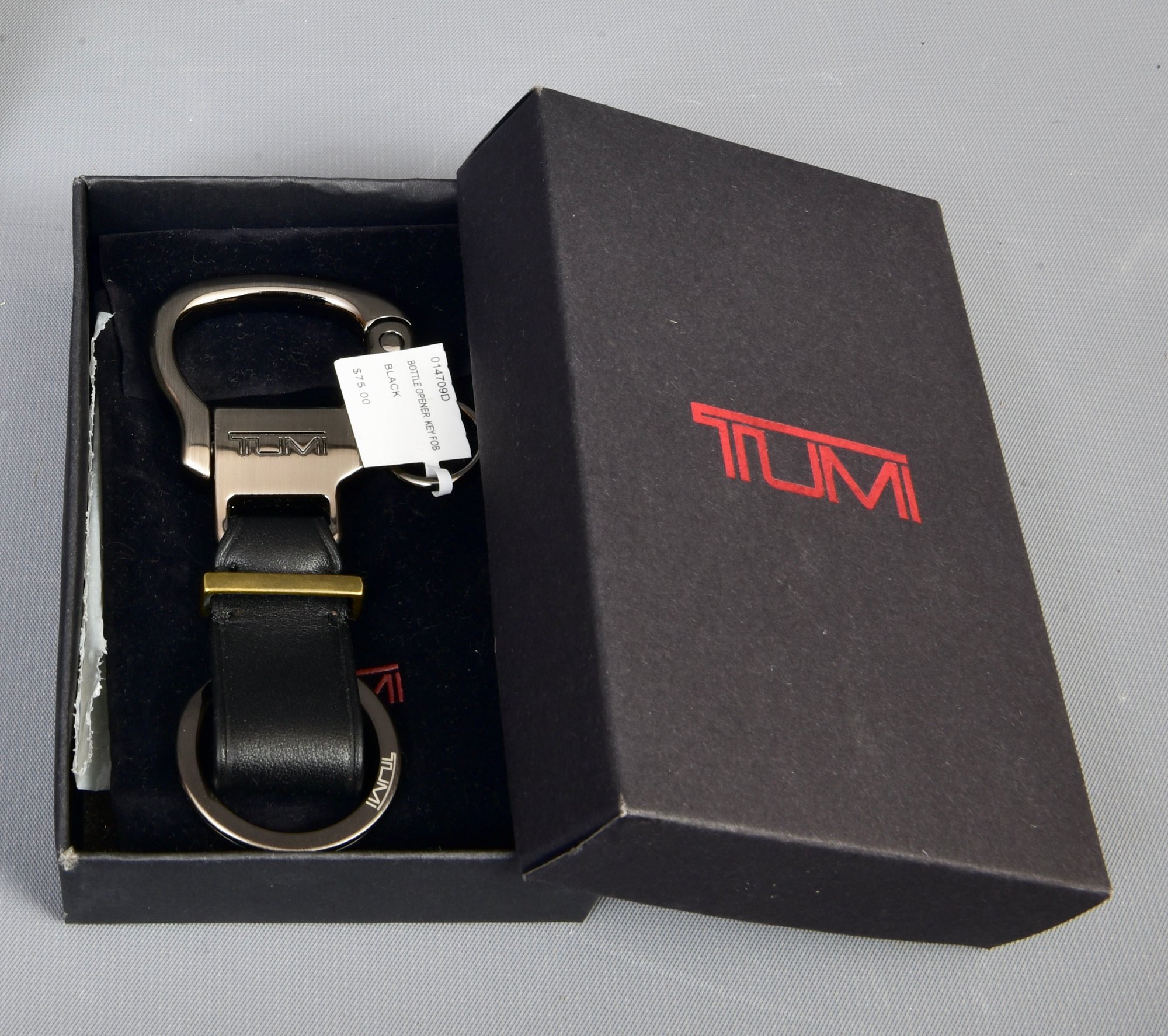 TUMI Bottle Opener Key Fob #40794396 | Auctionninja.com