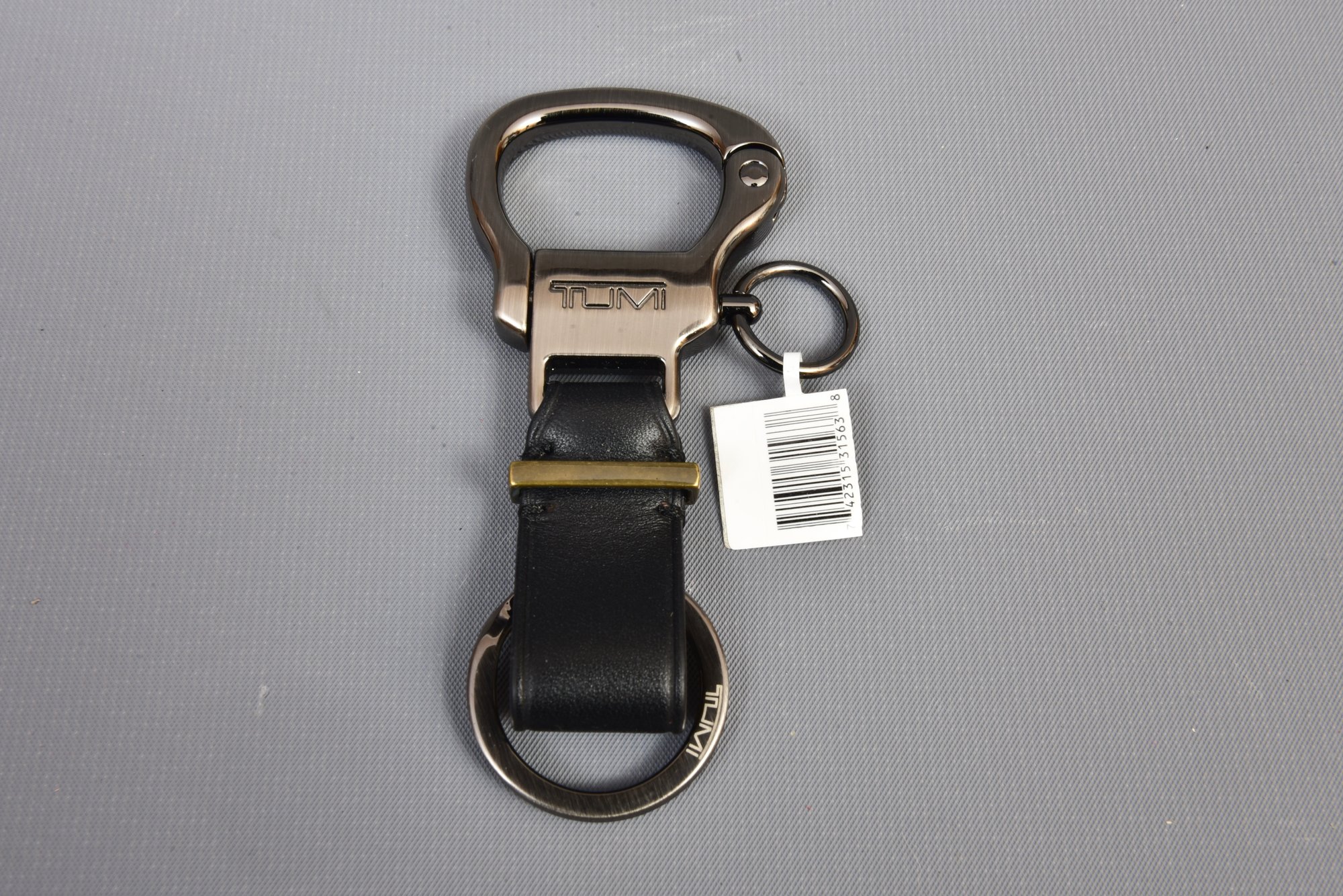 TUMI Bottle Opener Key Fob #40794396 | Auctionninja.com