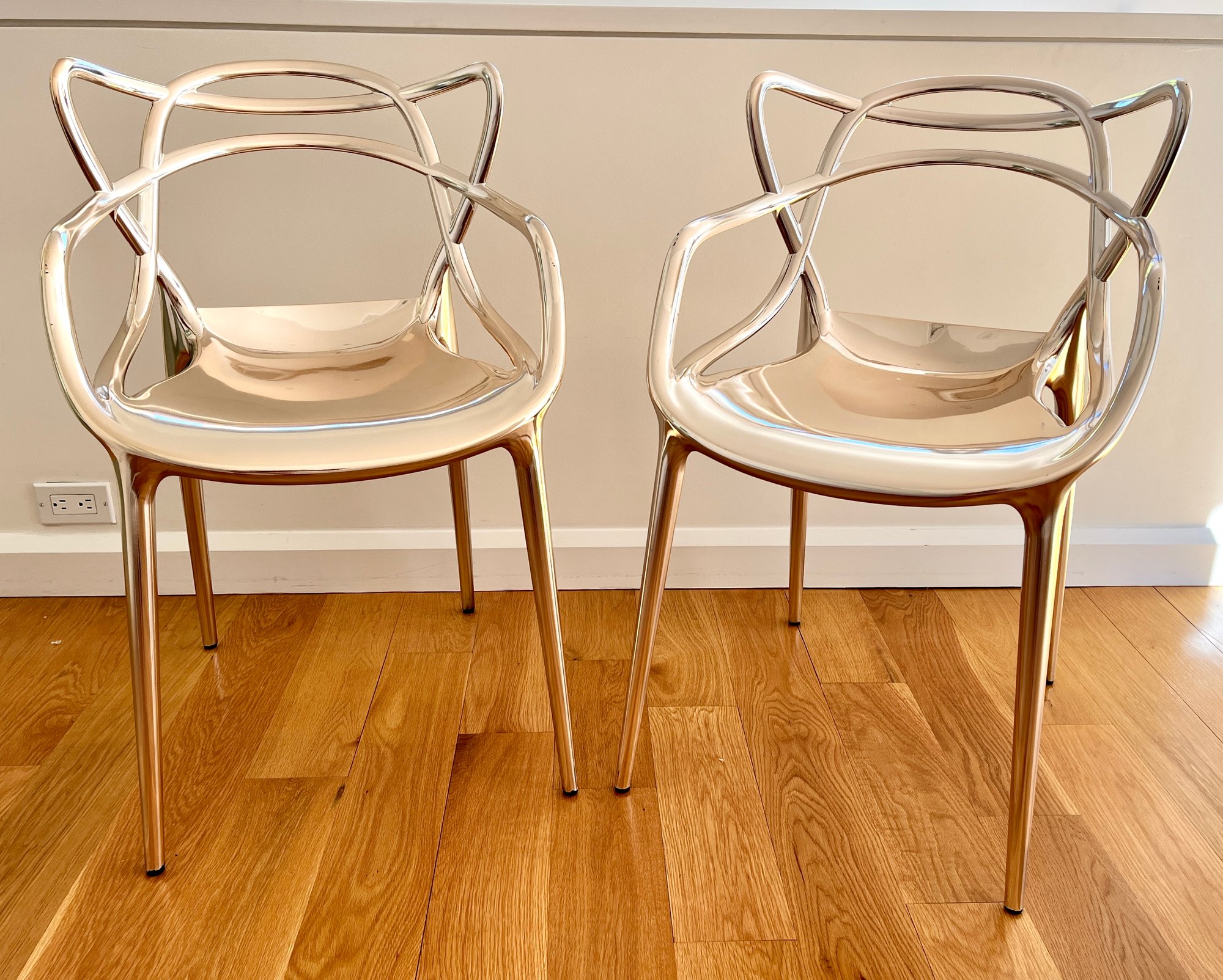 A Pair Of Metallic Finish Starck Design Plastic Chairs - Cartel ...
