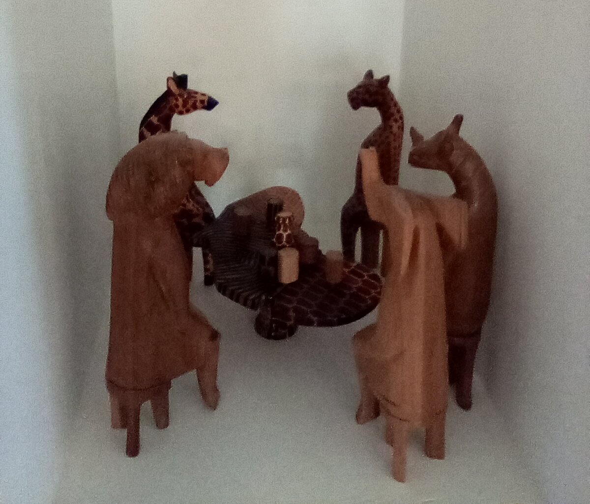 Kenya Collection Of Hand Carved Wood Animals Sitting Around A Table ...