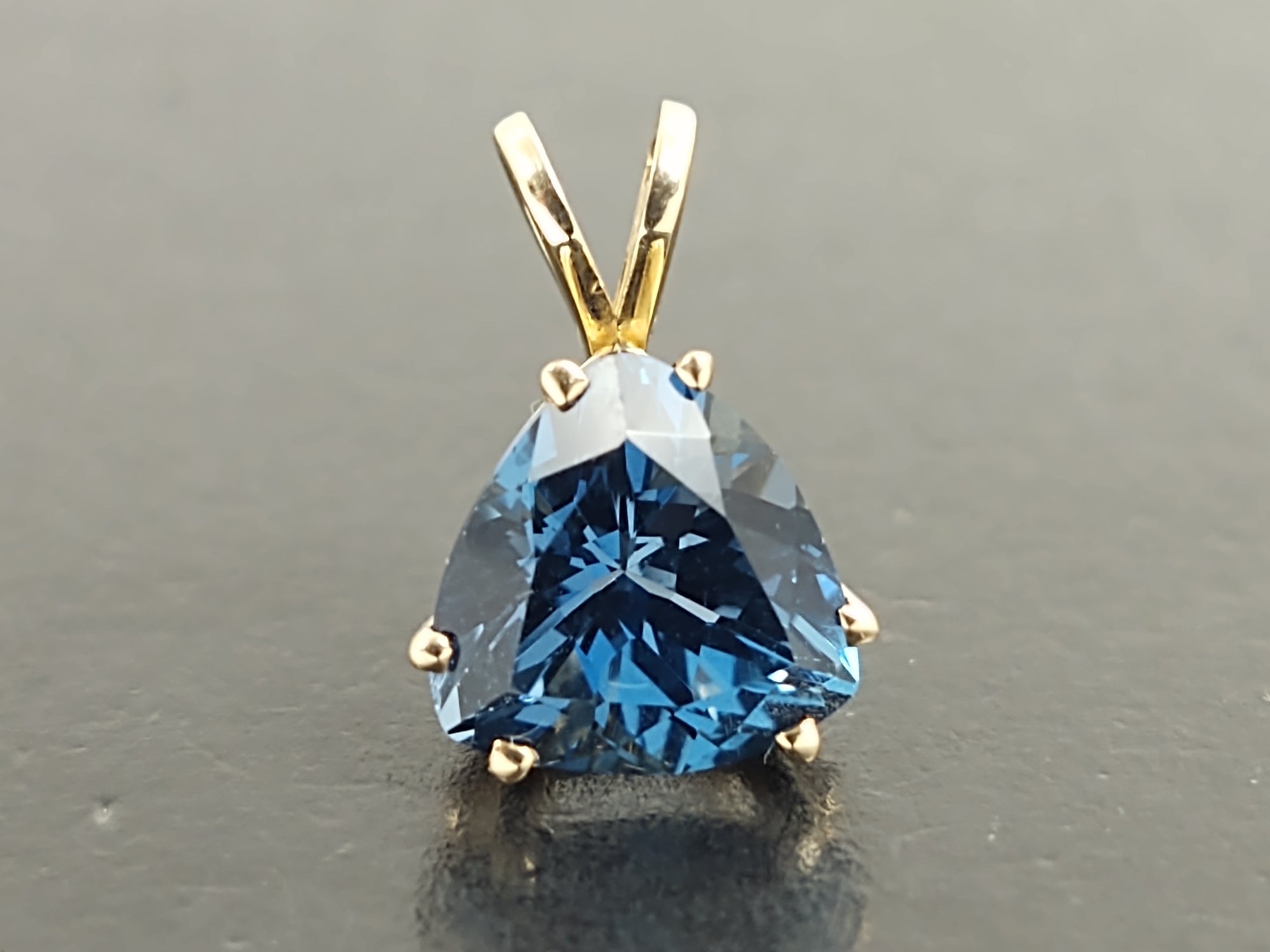 Stunning 10k Gold Triangle Royal Blue Topaz Pendant #2036232 | Auctionninja.com