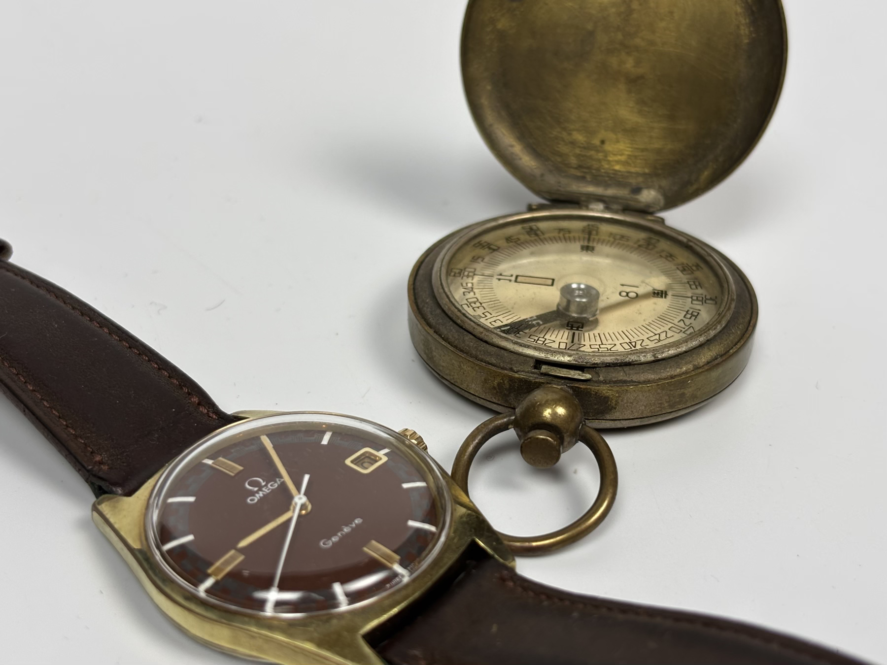 A Vintage Omega Swiss Watch And An Antique Brass Compass #40870313 ...