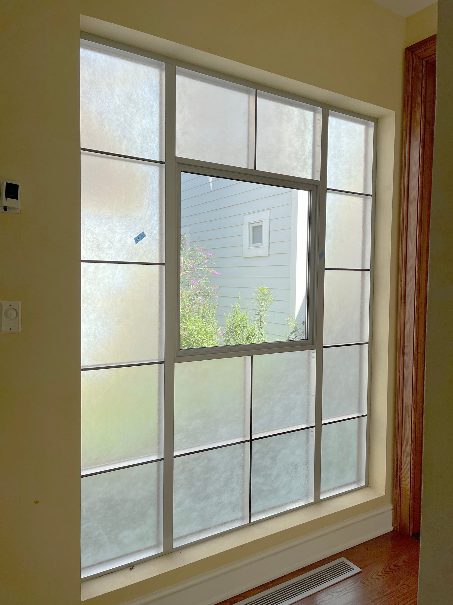 A Single Large Opaque Industrial Style Window With Clear Lite In Center ...