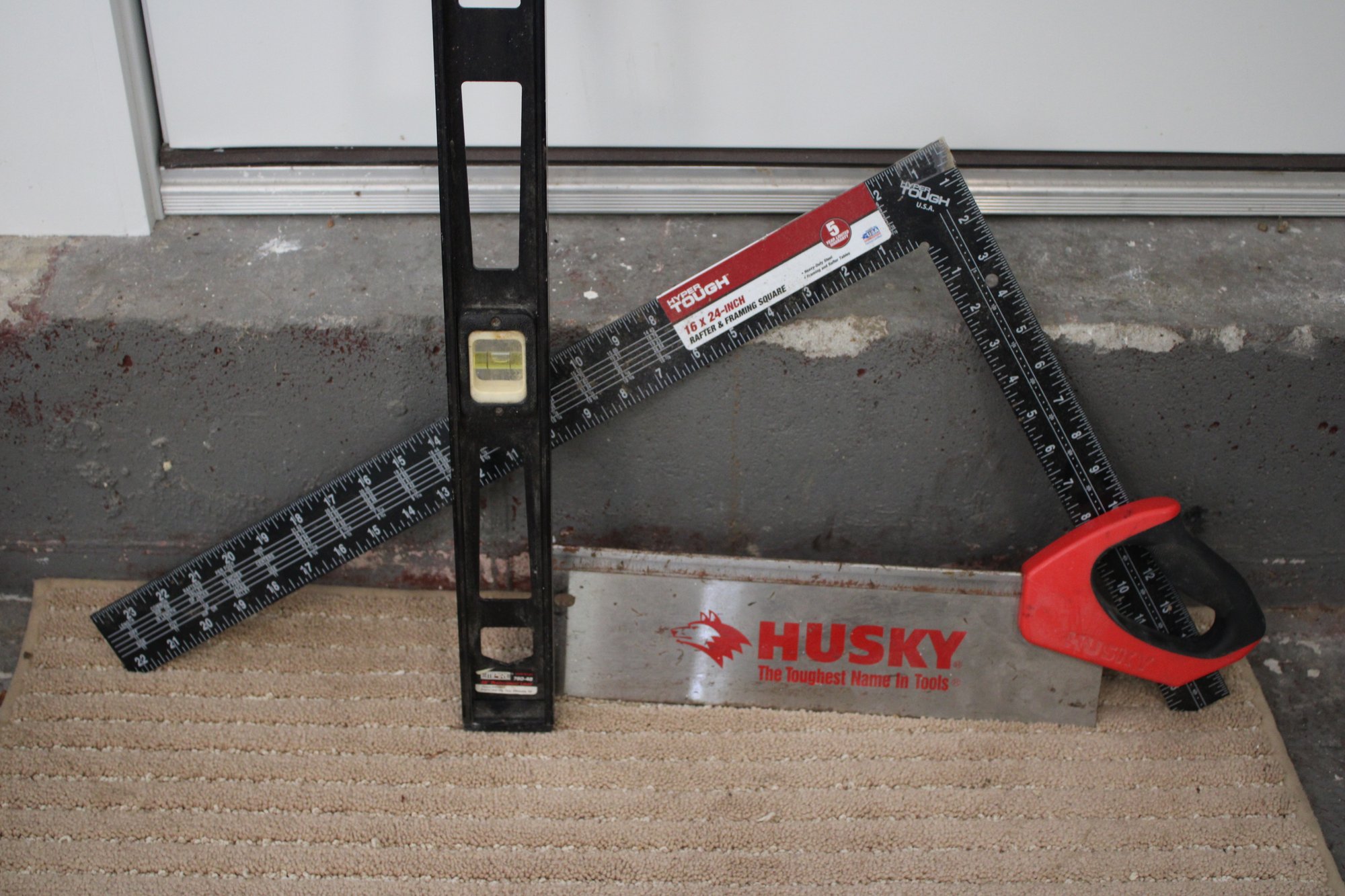 Mixed Tools With Husky Saw, Empire Level And Hyper Tough Square ...