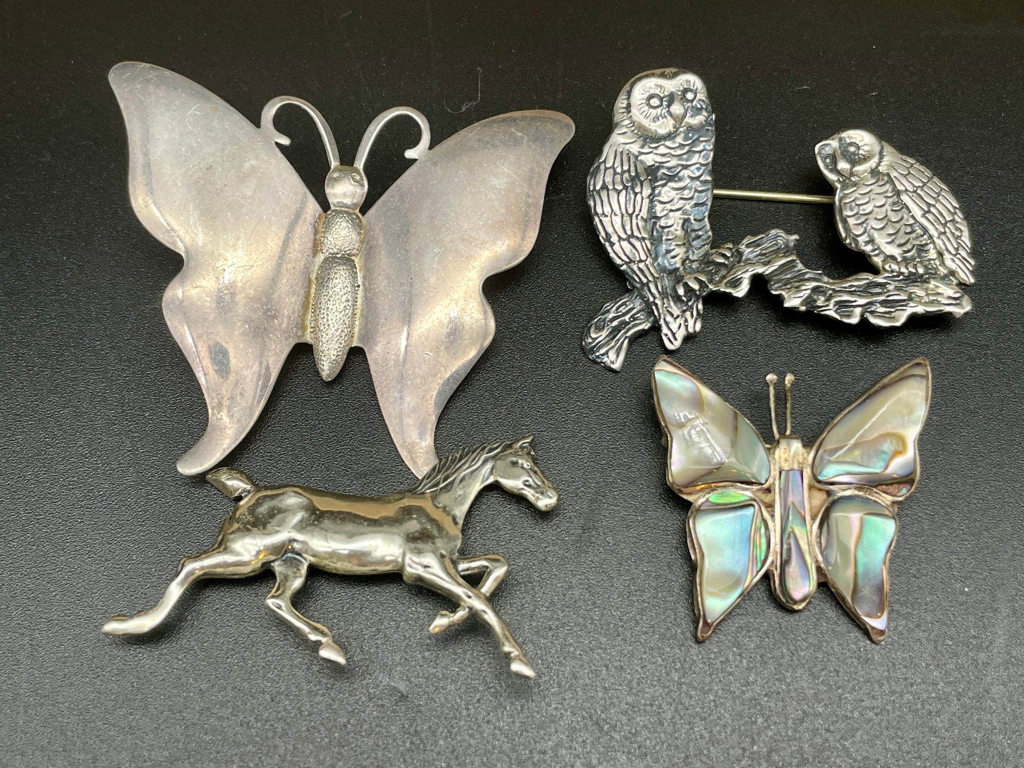 Four Sterling Silver Pins. #1861845 | Auctionninja.com