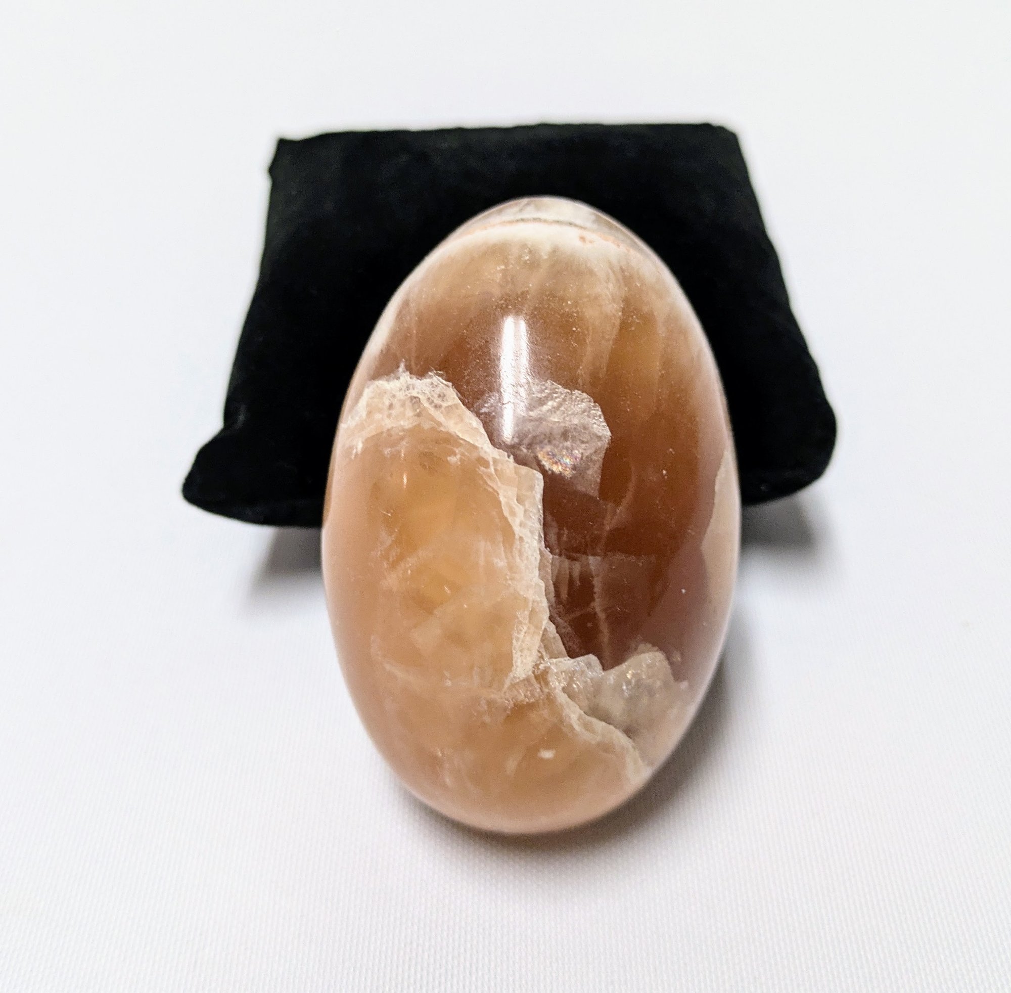 Caramel Calcite Stone Egg Shaped Paperweight #2192502 | Auctionninja.com