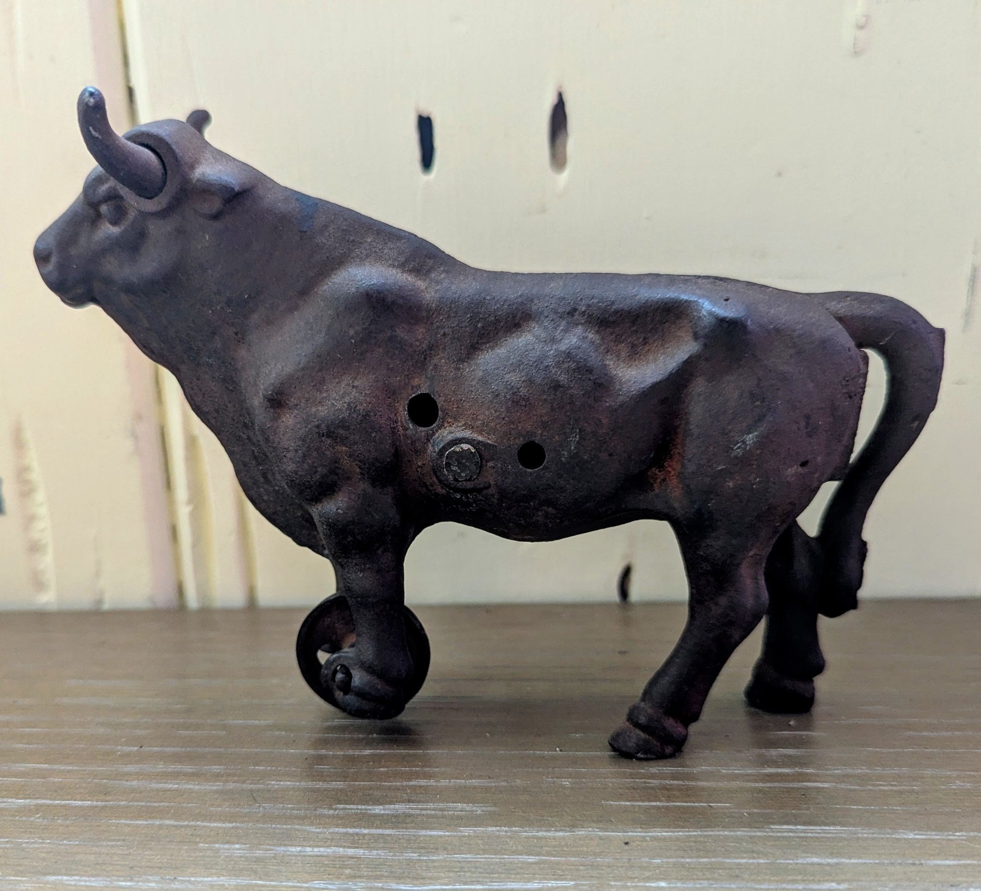 Antique? Caste Iron Bull With Wheel Between Legs #2240467 ...