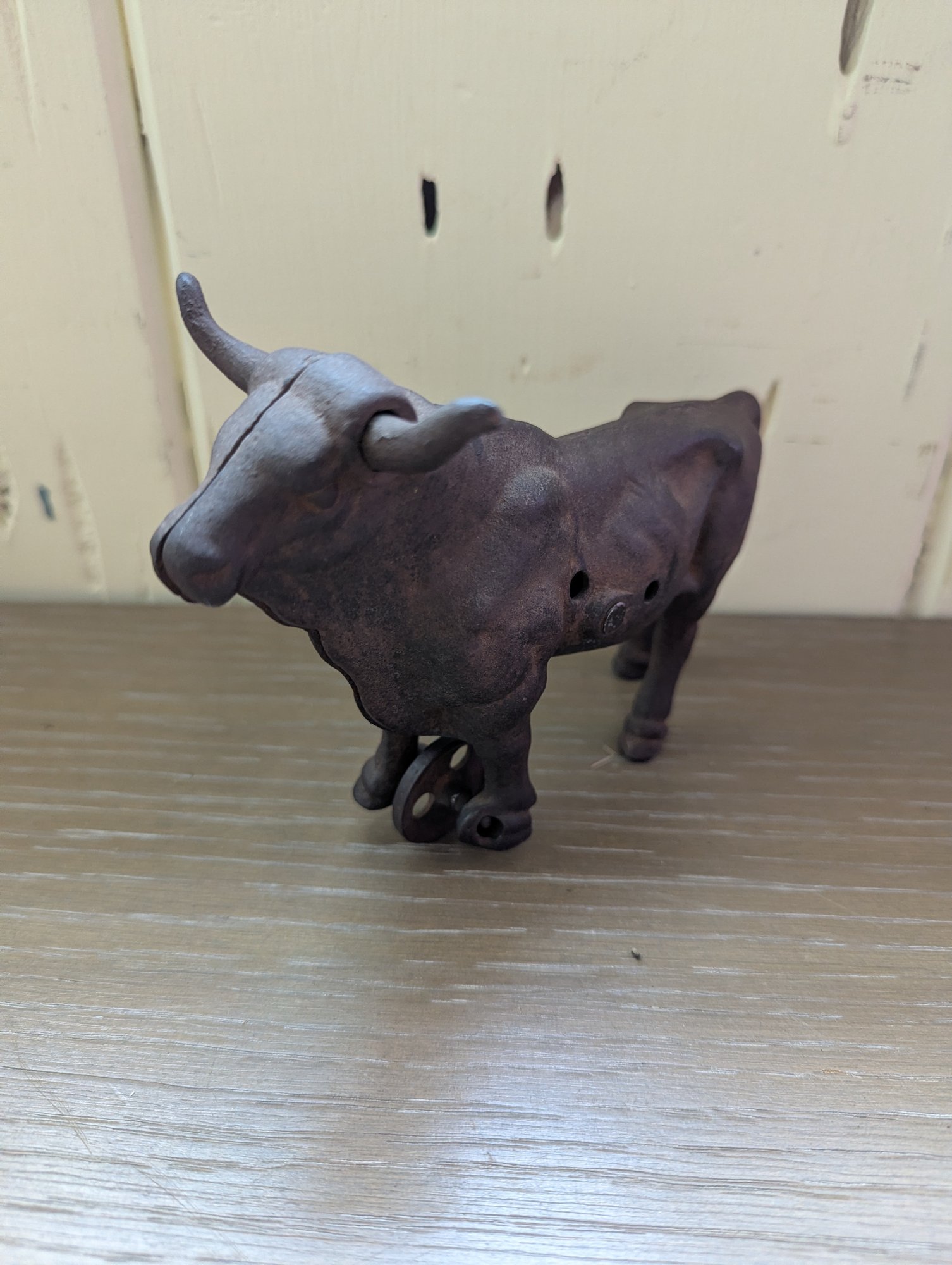 Antique? Caste Iron Bull With Wheel Between Legs #2240467 ...