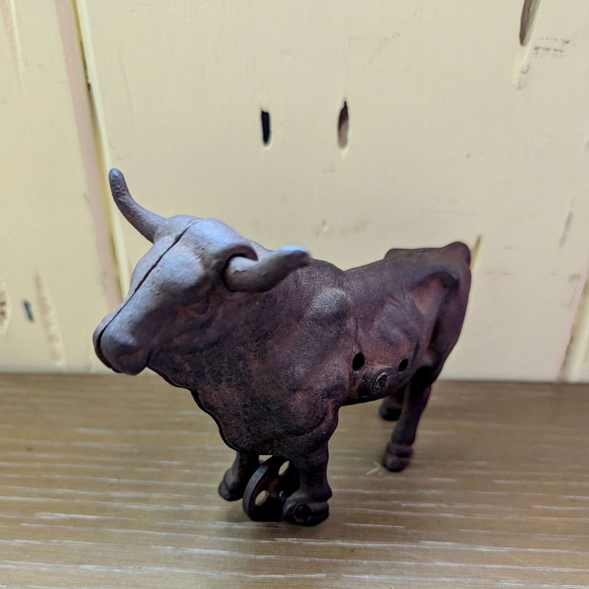 Antique? Caste Iron Bull With Wheel Between Legs #2240467 ...