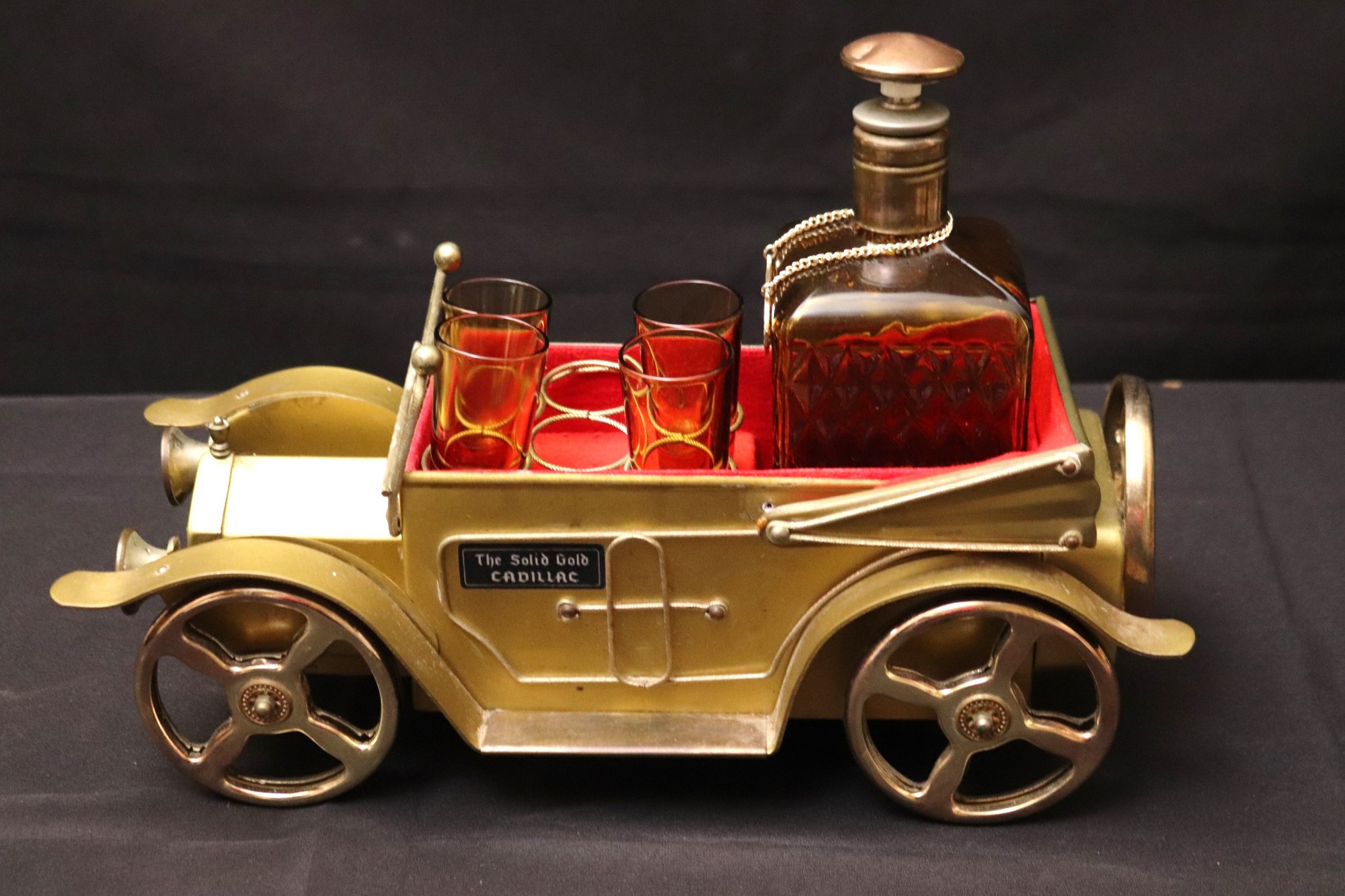 The Solid Gold Cadillac Music Box Decanter Set #52136 | Auctionninja.com