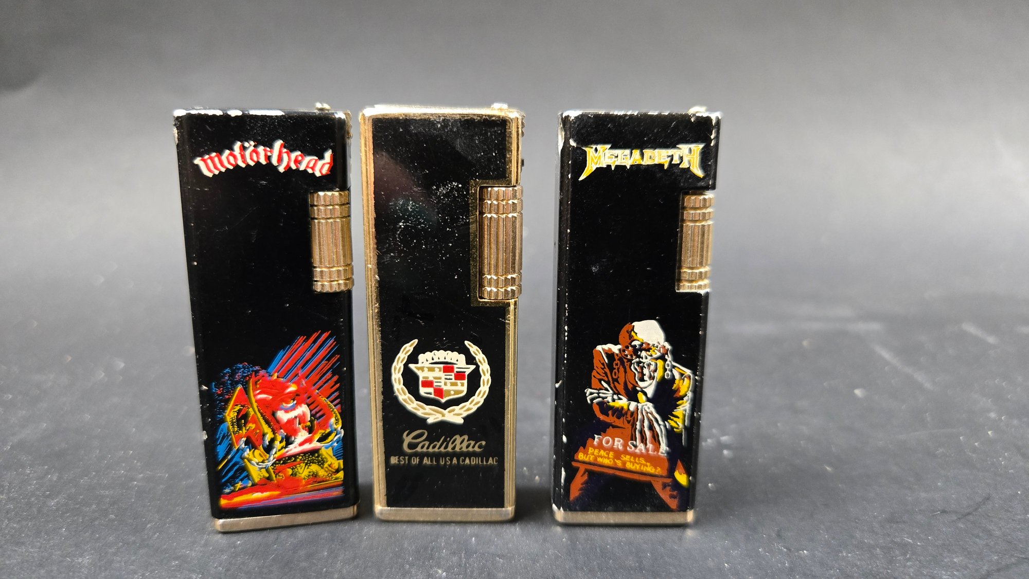 Three Used Lighters Megadeath , Motorhead, Cadillac #10975 ...