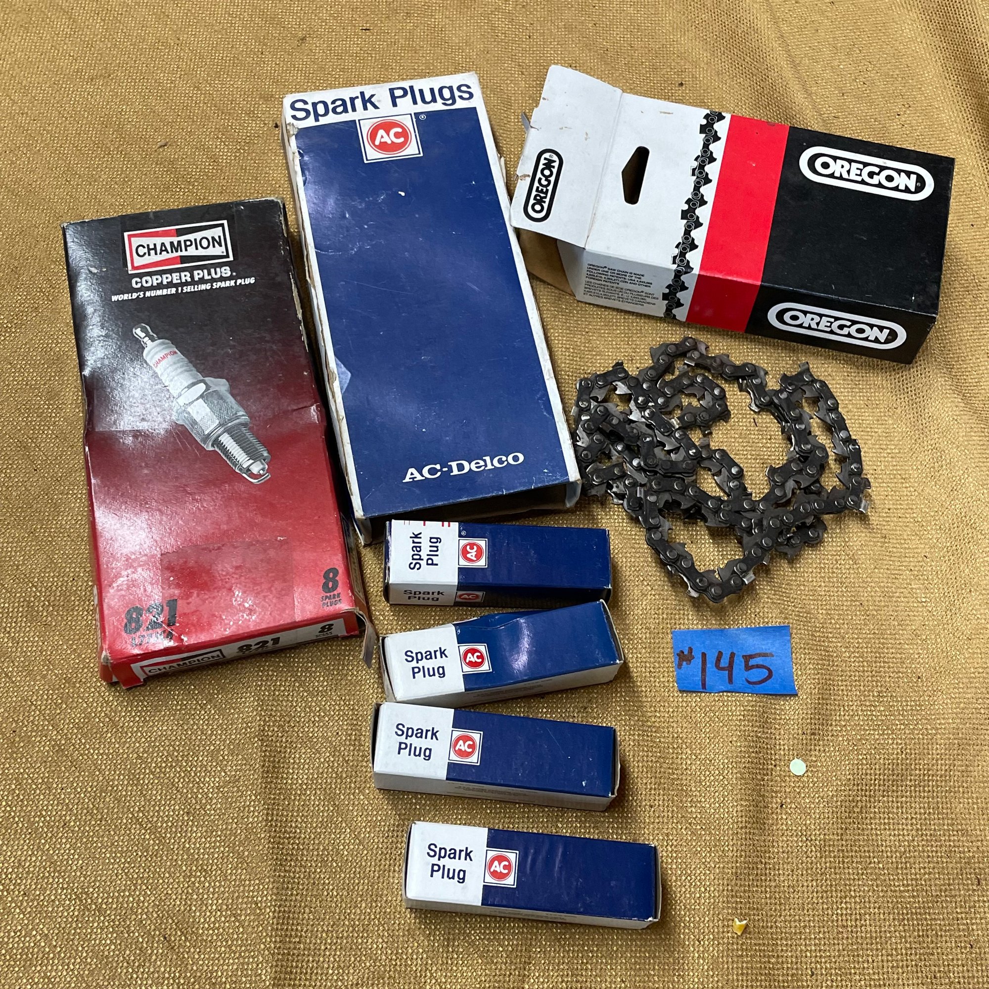 Spark Plugs & Chainsaw Chain Lot #24618 | Auctionninja.com