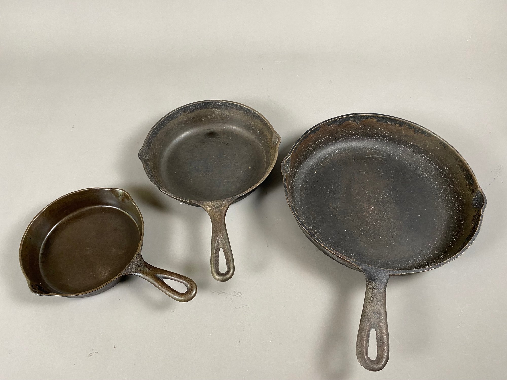 Three Cast Iron Skillets, WagnerWare, Lodge #2198 | Auctionninja.com