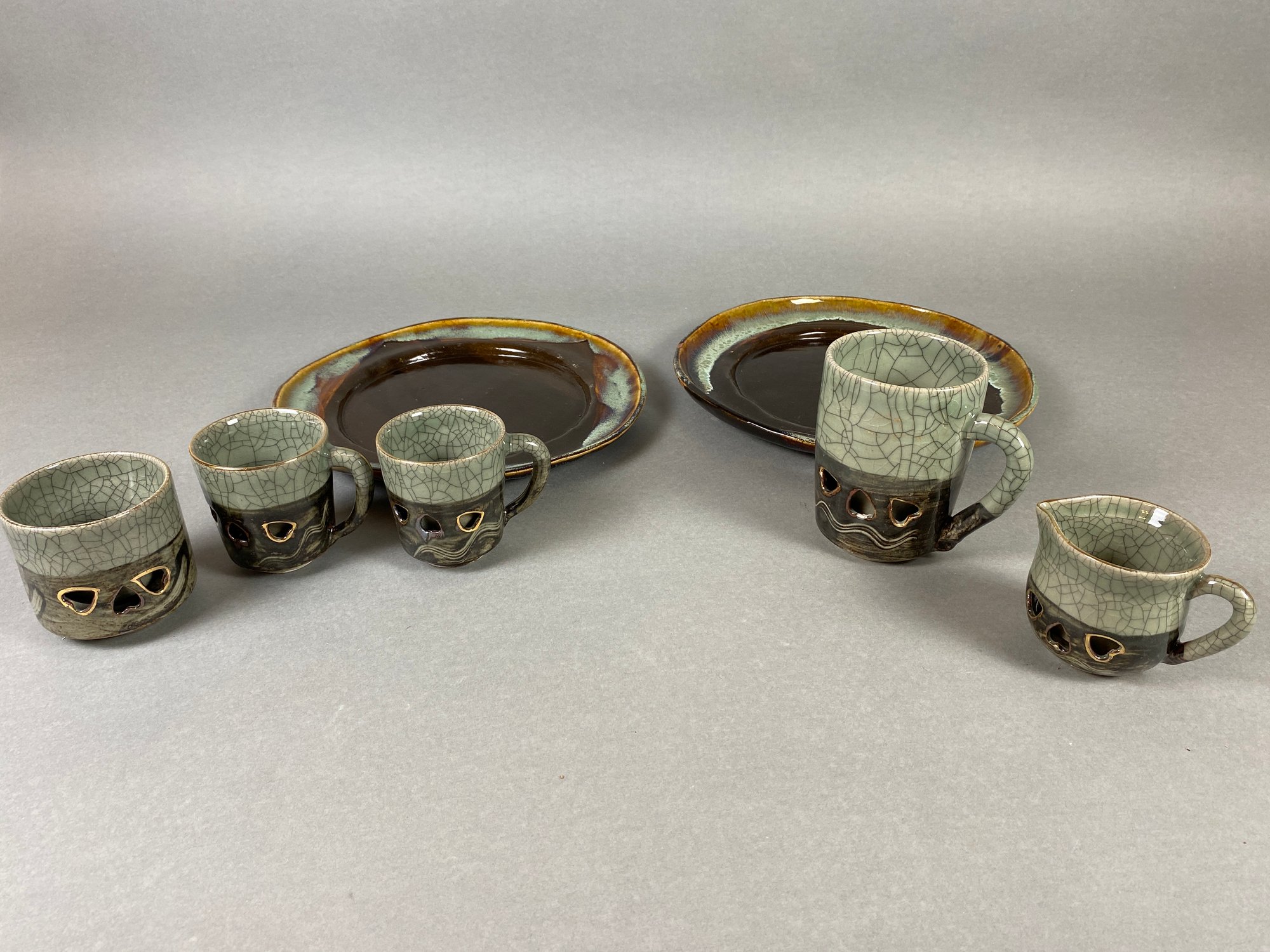Set Of Handmade Pottery Including Two Plates, Cups, A Creamer, A Sugar ...