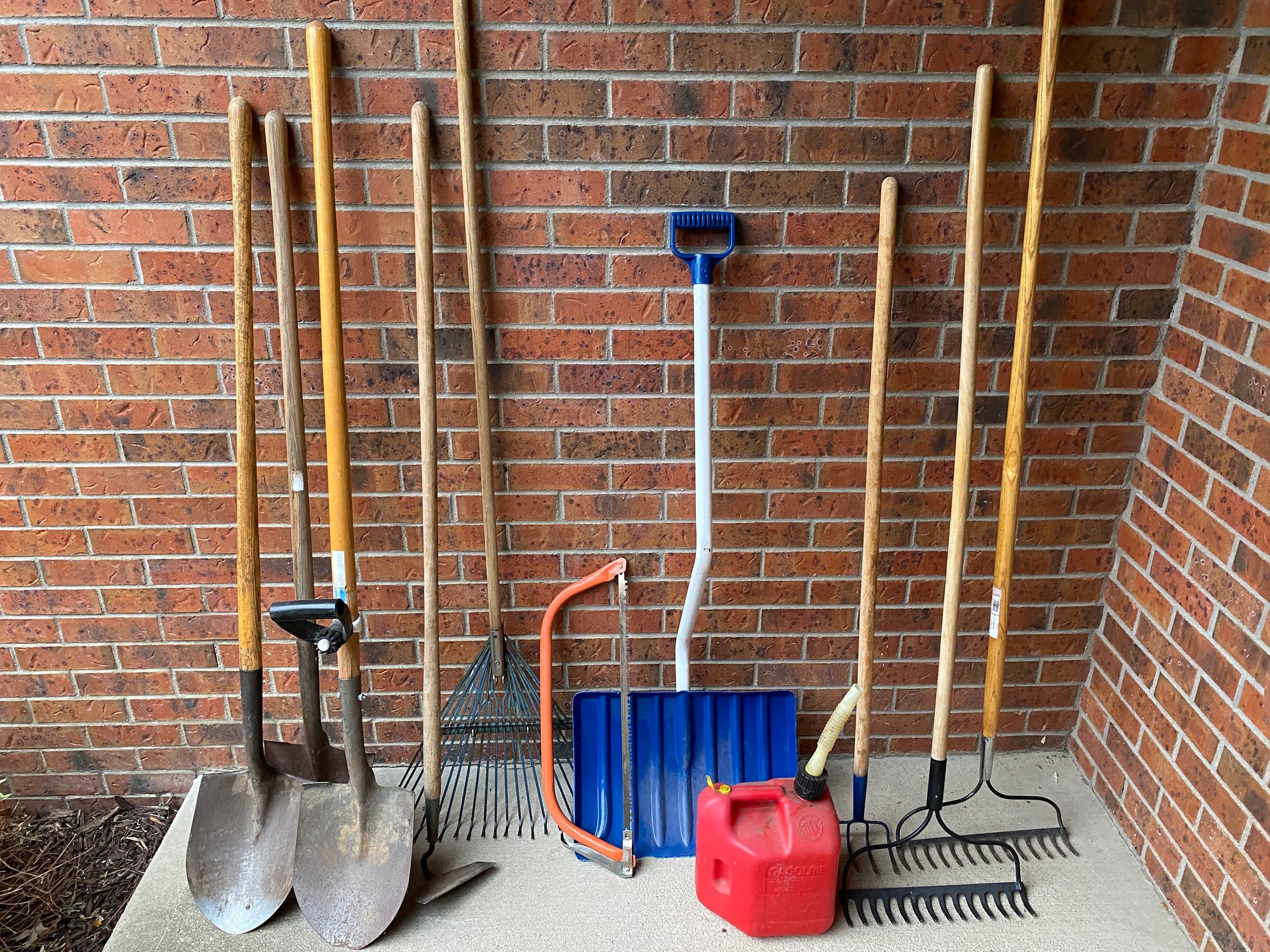 Many Landscaping Yard Tools Including Shovels, Rakes, A Hoe & More ...