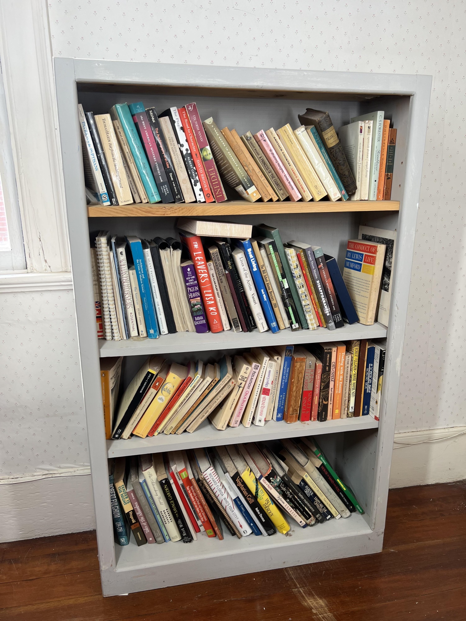 STANDING BOOKCASE filled with PAPERBACK BOOKS #49636 | Auctionninja.com