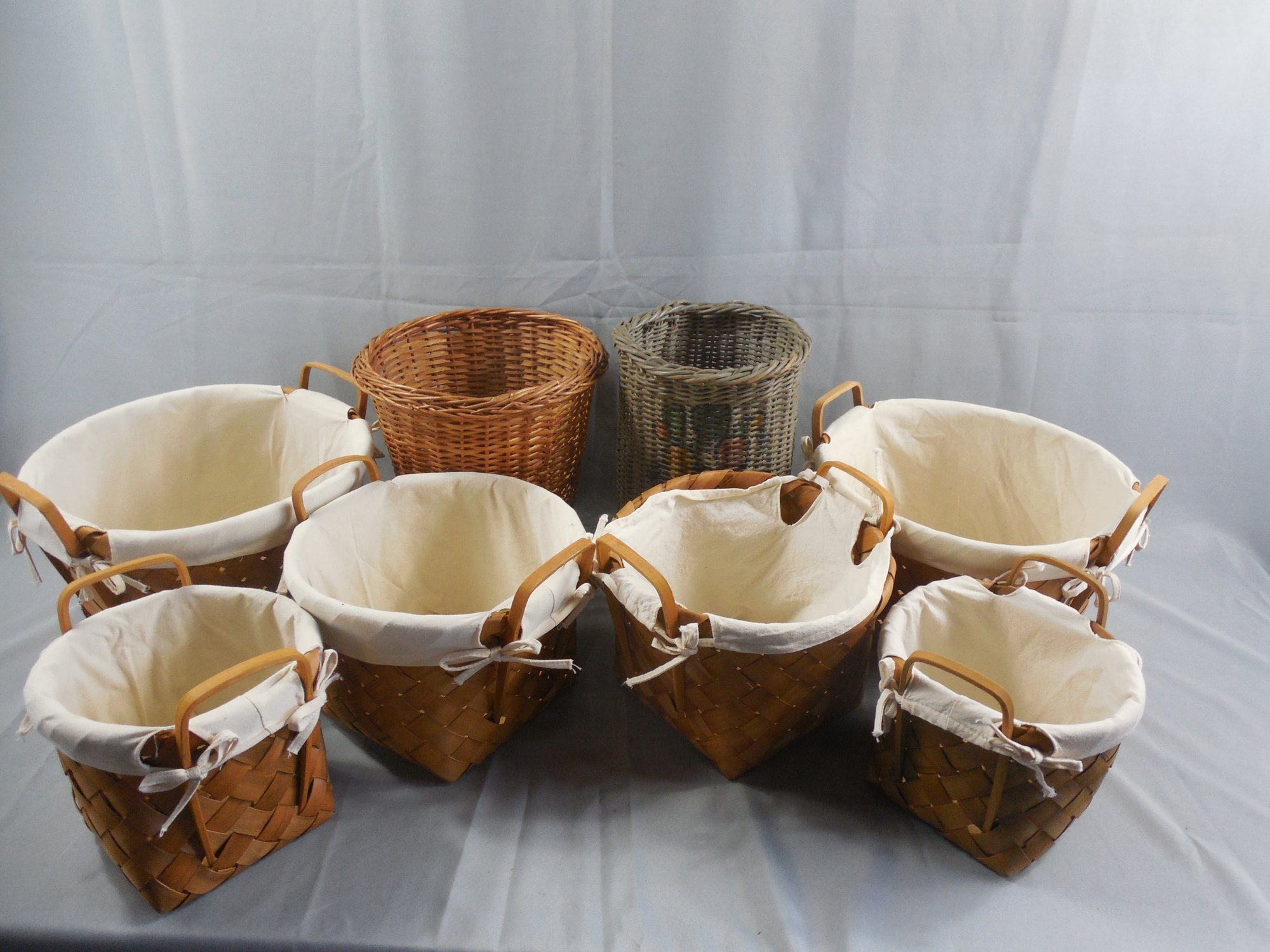 Linen Lined Nesting Baskets With Two Wooden Waste Baskets One Hand ...