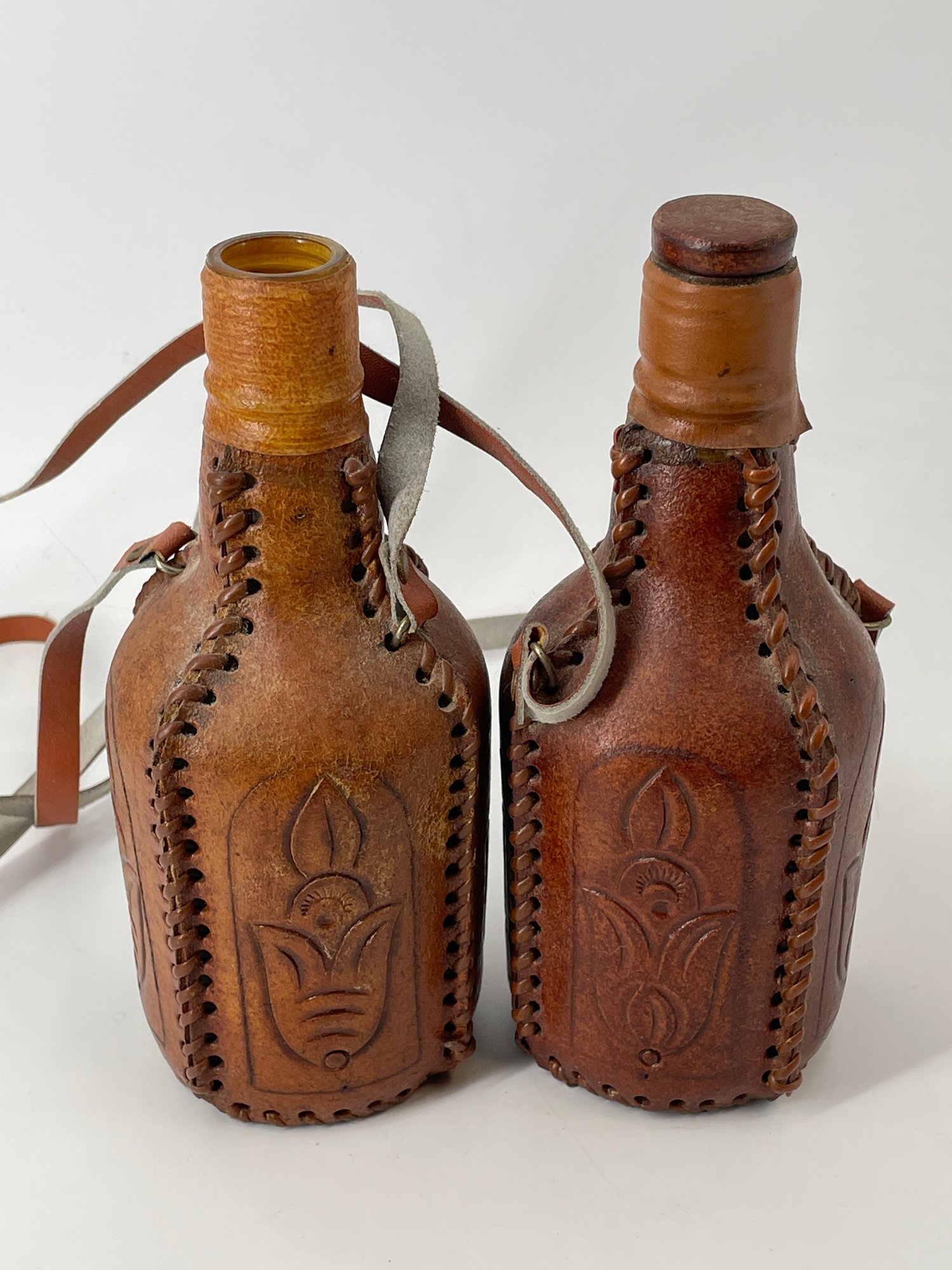 Pair Of Leather Wrapped Bottles #141478 | Auctionninja.com