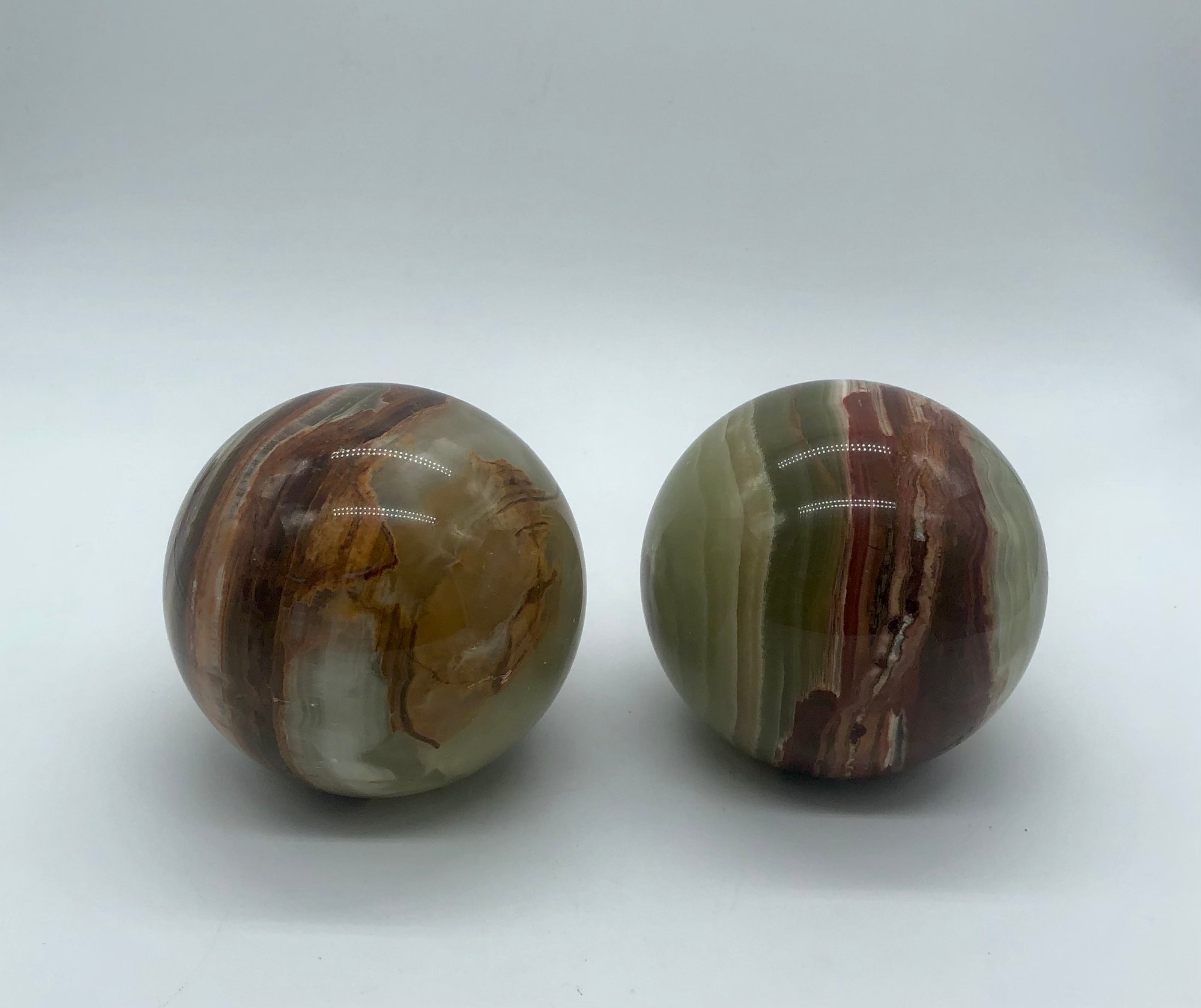 PAIR OF GREEN AND BROWN ONYX SPHERES #6490 | Auctionninja.com