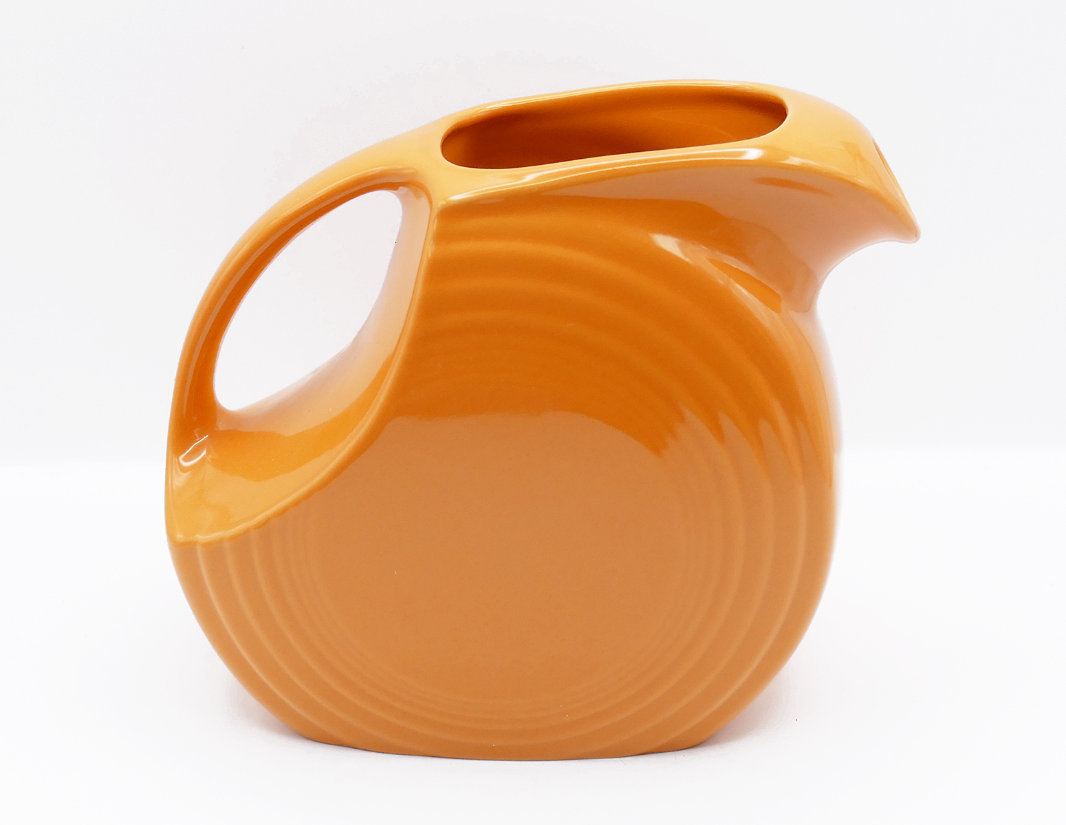 Large Orange Fiestaware Disc Water Pitcher #17125 | Auctionninja.com