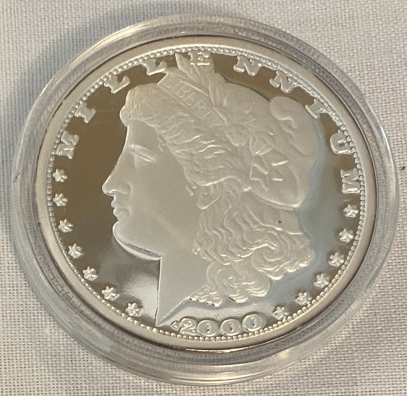 .999 100 Mil Silver Plated 2000 Millenium Coin #2 #4499 | Auctionninja.com