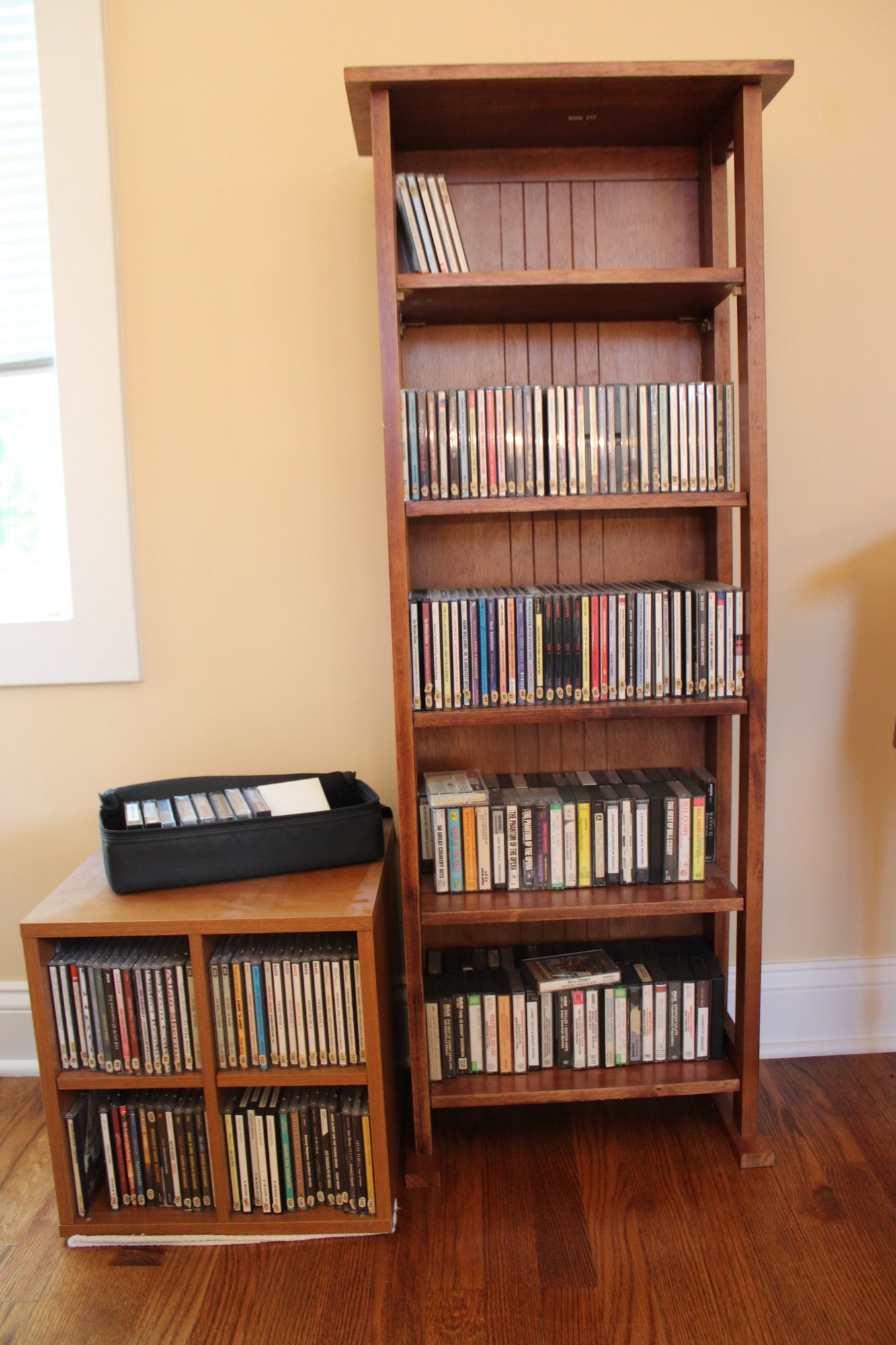 COLLECTION OF MUSIC CDS AND CASSETTES SOME AUDIO BOOKS WITH SHELVING ...